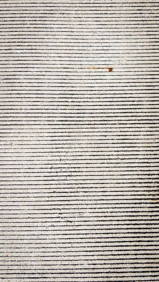 A Vertical Abstract Close-up of a Concrete Surface Featuring Straight ...