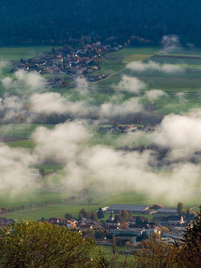 Vertical Aerial View of a Cityscape through the Clouds Stock Image ...