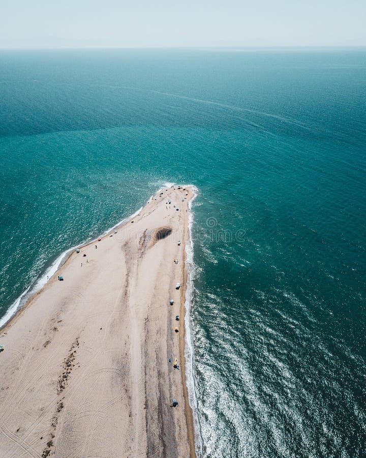 Vertical Aerial View of Turquoise Ocean Wave Reaching the Coastline ...