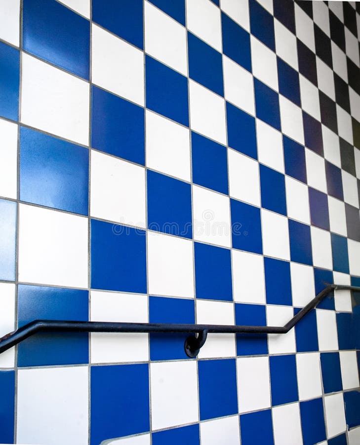 Vertical Angled Image of a Blue and White Checkered Wall with a Black ...