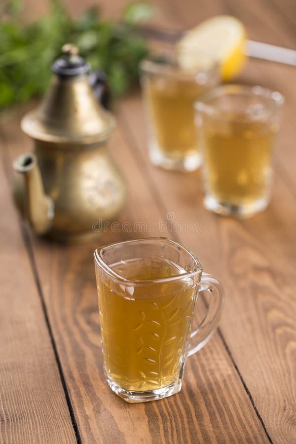 Arabic Mint and Lemon Tea Glass with Teapot on Wooden Table Stock Image ...