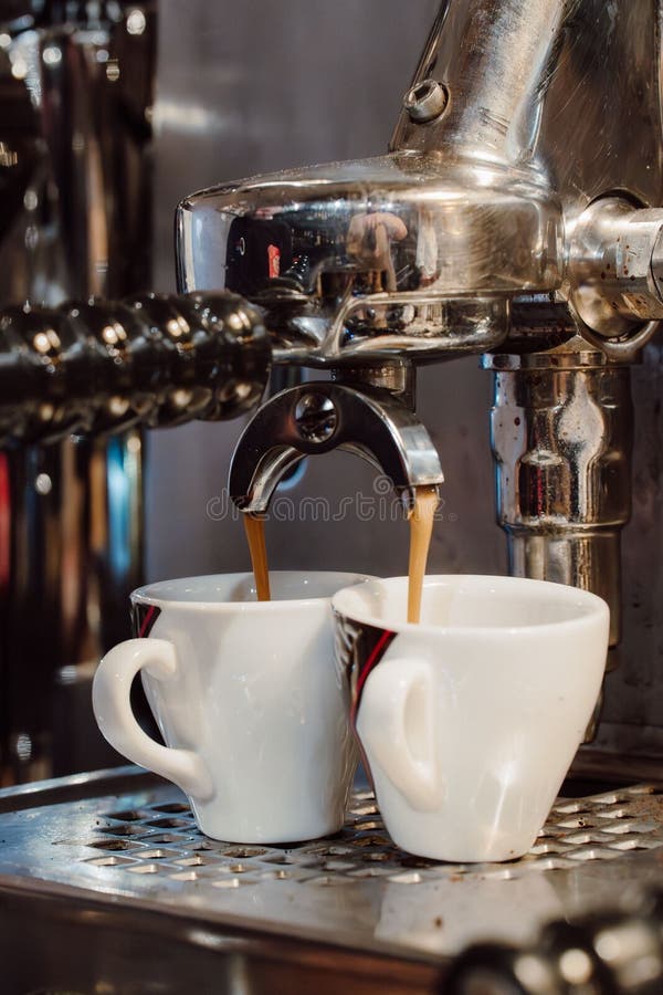 Vertical of an Automated Coffee Machine Filling Two Cups with Coffee ...