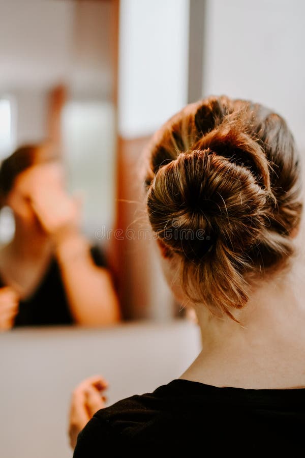 Vertical Back View of a Female with a Messy Bun Hairstyle Stock Photo ...