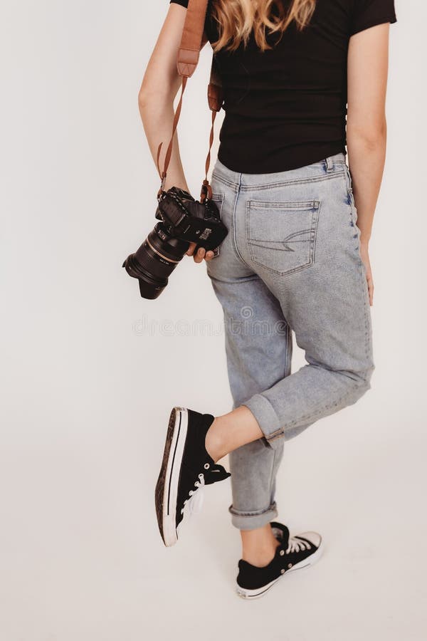 Vertical Back View of a Female Photographer Walking with a Camera Stock ...