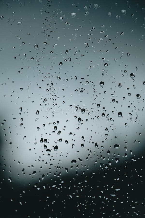 Vertical Background of Some Moody Rain Drops Over a Window with Dark ...