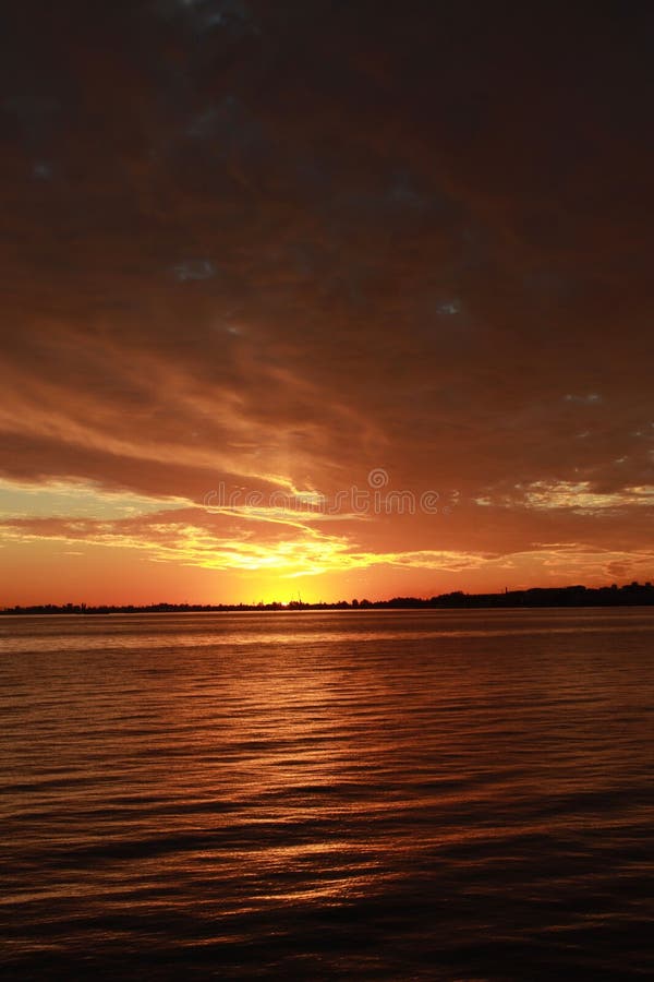 Vertical of a Beautiful Golden Sunset Over the Sea. Stock Image - Image ...