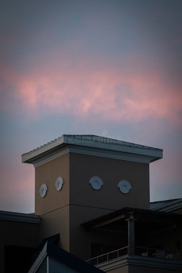Vertical of a Beautiful Sunset Over a Building. Stock Image - Image of ...