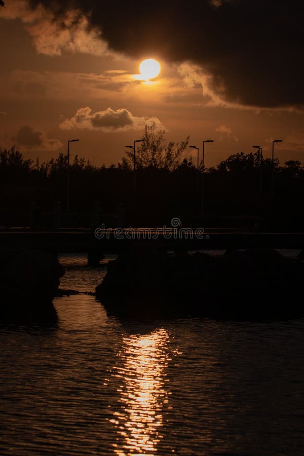 Vertical of a Beautiful Sunset Over the Lake and Trees. Stock Photo ...