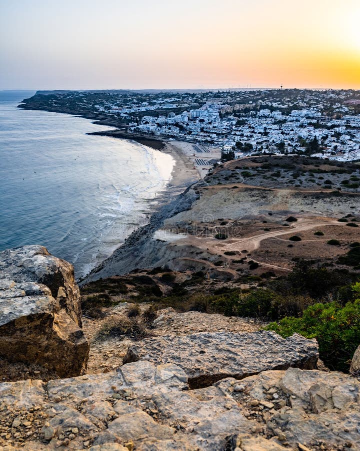 Vertical of a Beautiful Sunset Over the Town and the Beach. Stock Image ...