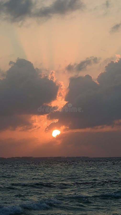 Vertical of a Beautiful Sunset with a Round Sun Stock Image - Image of ...