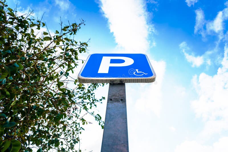 A Vertical Blue Pole Sign Marking a Parking for Disabled Vehicles Stock ...