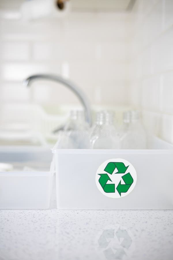 Vertical. a Box with a Recycling Sign and Plastic Bottles Inside Stands ...