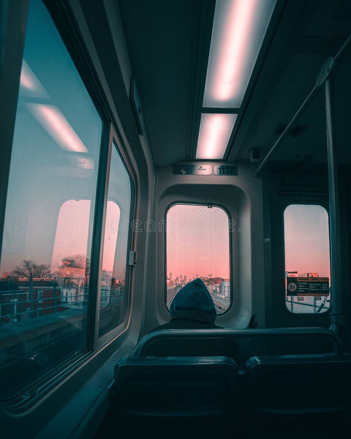 View from Behind Fence of People Silhouette Walking on the Beach Near ...
