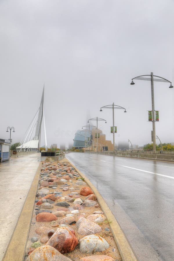 Vertical of Bridge and Museum for Human Rights in Fog in Winnipeg ...