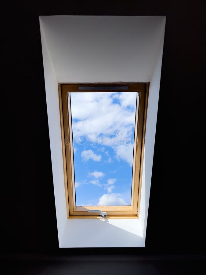 Vertical of the Bright, Cloudy Sky Seen from a Ceiling Window in a Dark ...