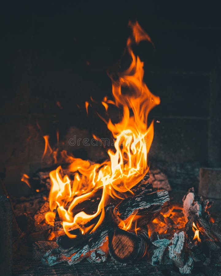 Vertical of a Burning Fire Flames Captured in a Fireplace Stock Image ...