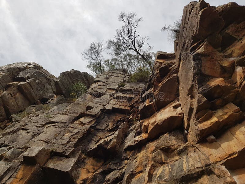 Vertical Cliff Rising Up To The Sky At Muriwai Beach Stock Image ...