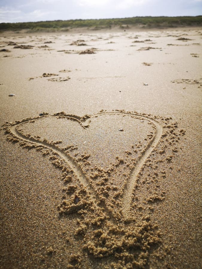 Vertical Close-up Shot of a Heart Shape on a Sandy Beach Stock Image ...