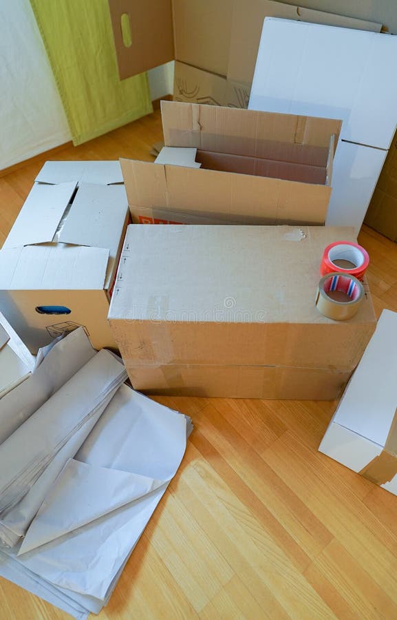 Vertical Close Up View of Moving Boxes and Materials on a Wooden ...