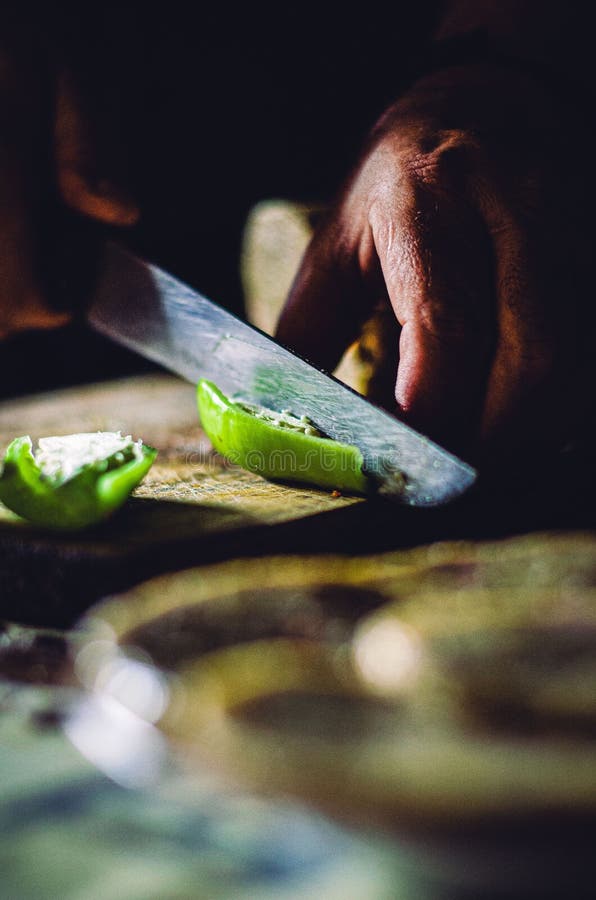 Vertical Close-up View of a Pepper-cutting Process Over the Cutting ...