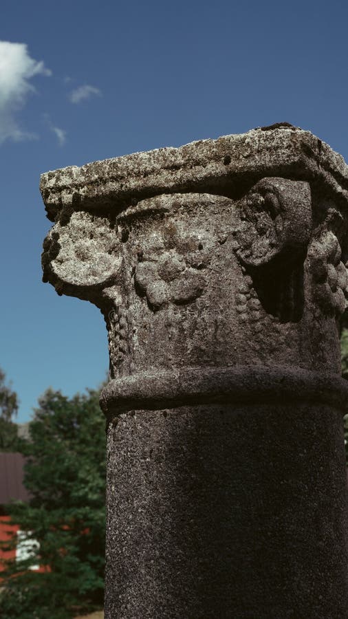 Vertical Closeup of an Ancient Stone Column with Ornamental Details ...
