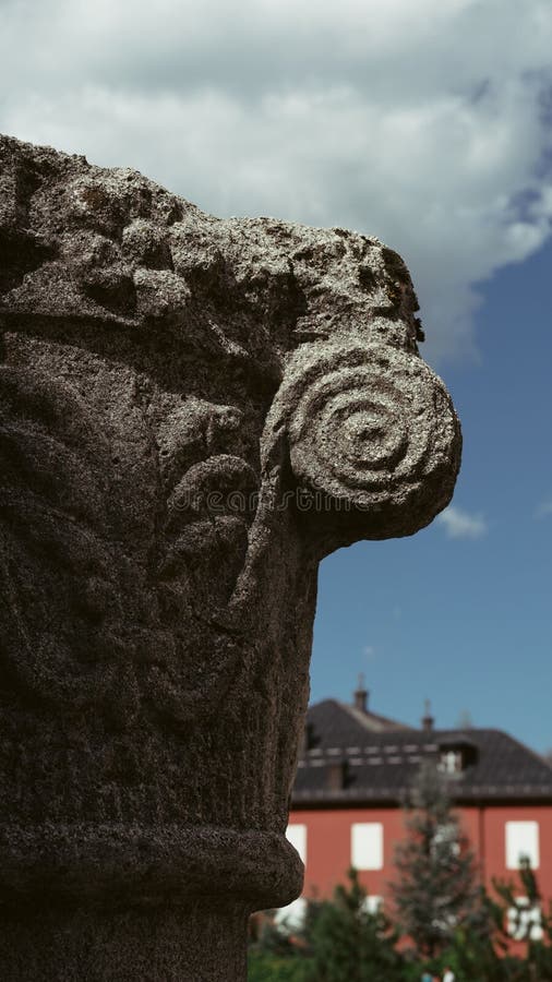 Vertical Closeup of an Ancient Stone Column with Ornaments Under ...