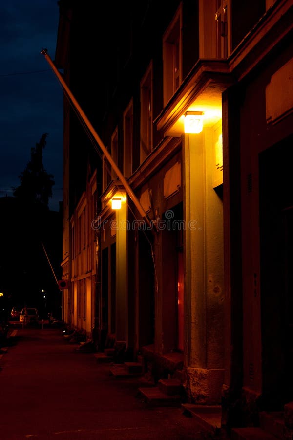 Vertical Closeup Angular Shot of a Building with Lighted Lights during ...