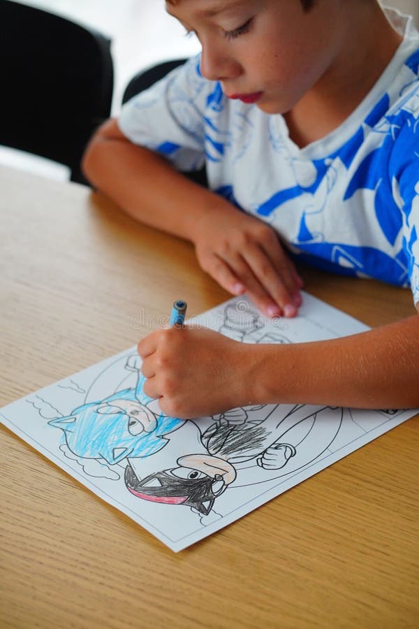 Vertical Closeup of a Boy Drawing a Picture with a Pencil Editorial ...