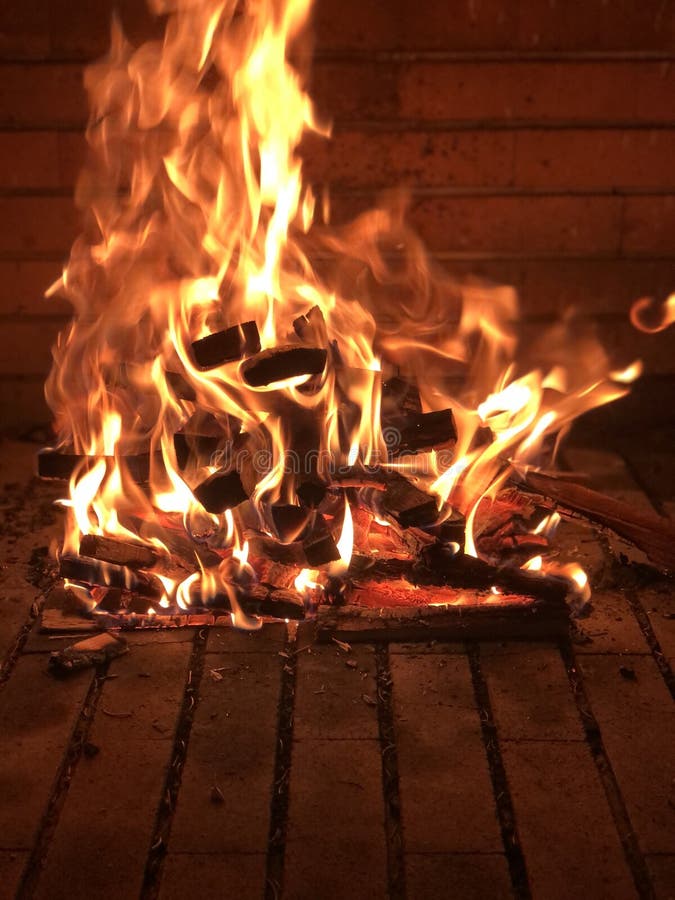 Vertical Closeup of a Bright Campfire on a Brick Surface Stock Photo ...