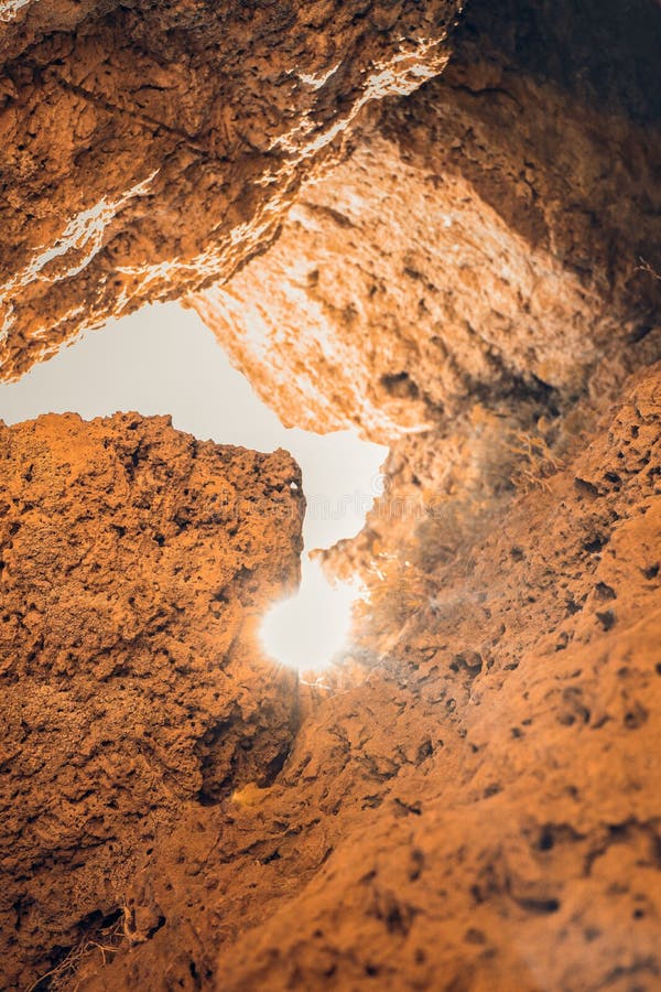 Vertical Closeup of a Bright Sunlight Seen through a Cave and Rock ...