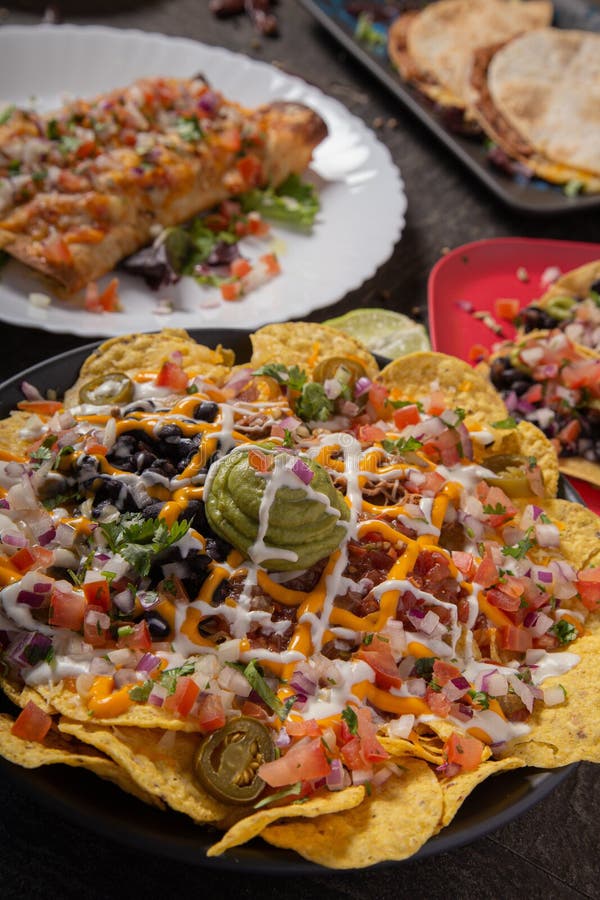 Vertical Closeup of Delicious Nachos with Vegetable Toppings on a ...
