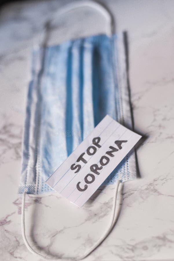Vertical Closeup of a Face Mask with a [stop Corona] Sign on it on the ...