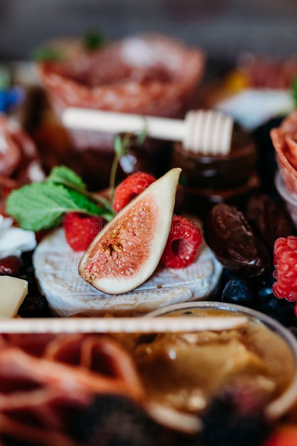 Vertical Closeup of Fruits, Honey, and Meat Snacks Stock Image - Image ...