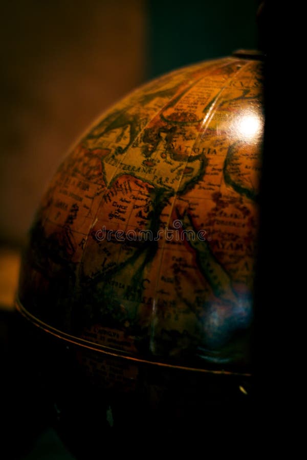 Vertical Closeup of a Globe Displaying a Map of Ancient Times Captured ...