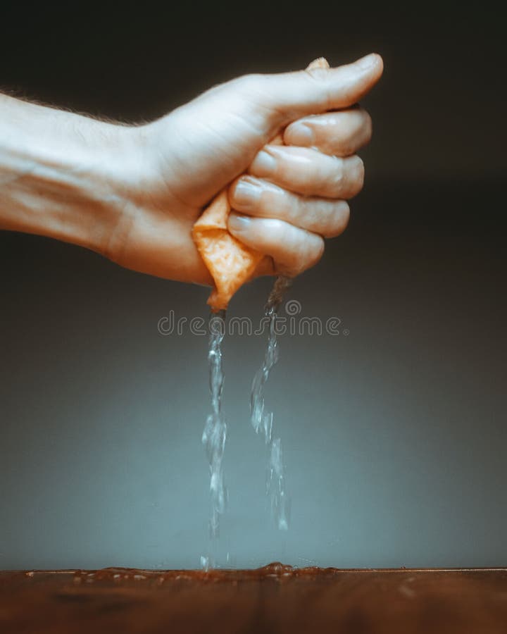Vertical Closeup of a Hand Squeezing a Sponge Wipe. Stock Photo - Image ...