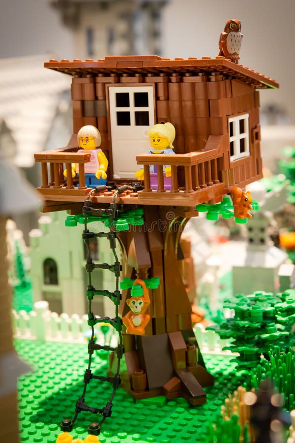 Vertical Closeup of a Lego House on a Tree with People Editorial ...