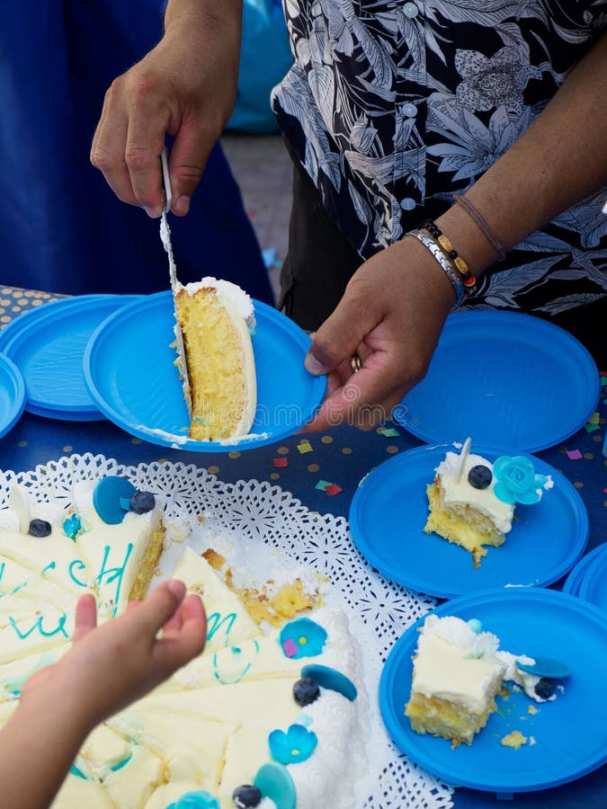 Vertical Closeup of People Cutting a Birthday Cake at a Party Stock ...