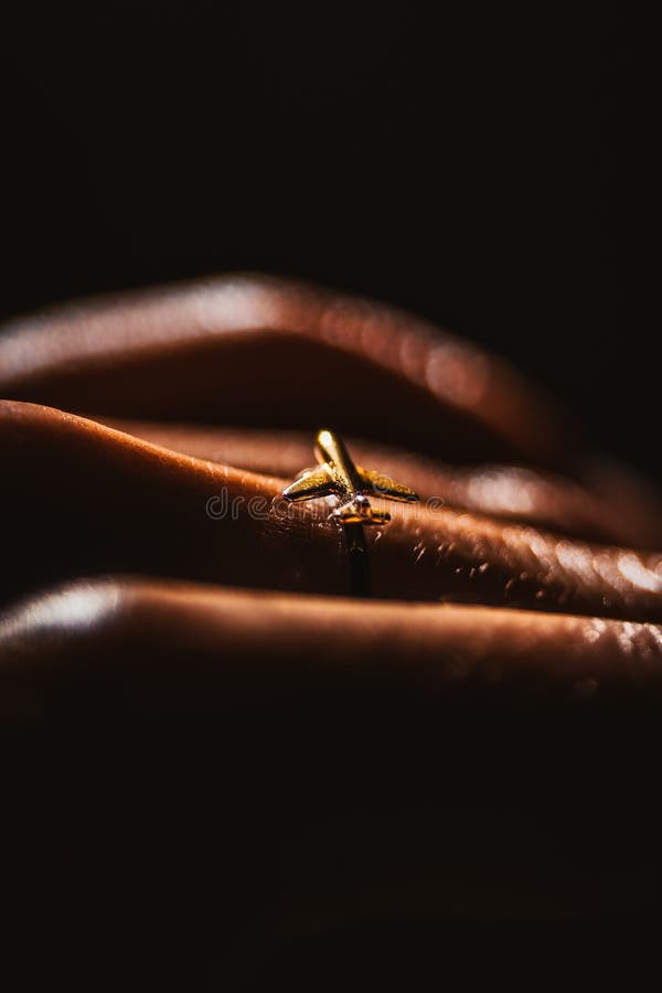 Vertical Closeup of a Plane Ring on the Ring Finger, Blurred Background ...