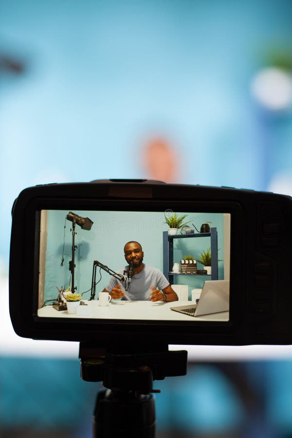 Vertical Closeup of Professional Digital Camera on Tripod Recording ...