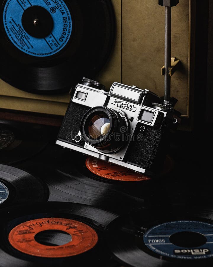 Vertical Closeup of a Retro Camera on Phonograph Records. Editorial ...