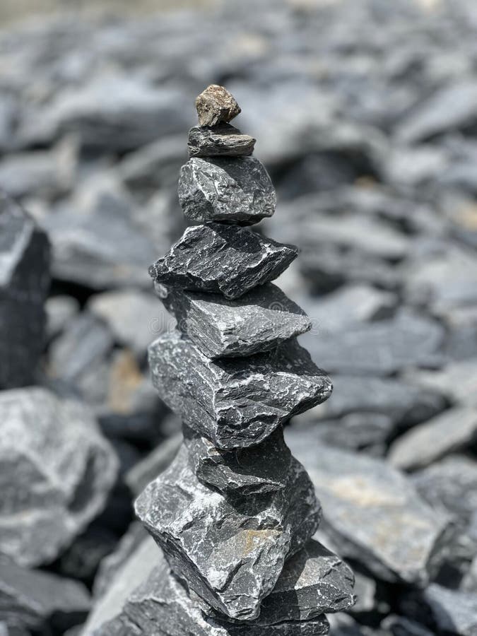 Rock Tower on a Natural Rock Formation Against an Ocean Background and ...