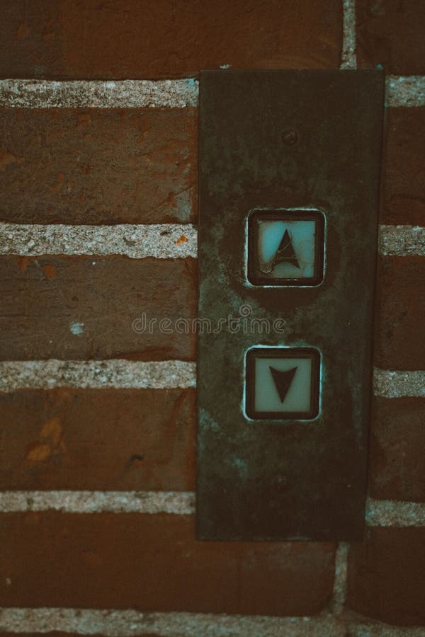 Vertical Closeup of a Rusty Elevator Dispatching Control System with ...