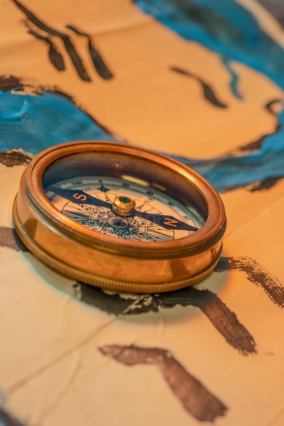 Vertical Closeup Shot of an Antique Direction Compass on a Map Stock ...