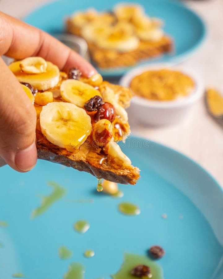 Vertical Closeup Shot of a Bitten Bread with Bananas and Honey Stock ...