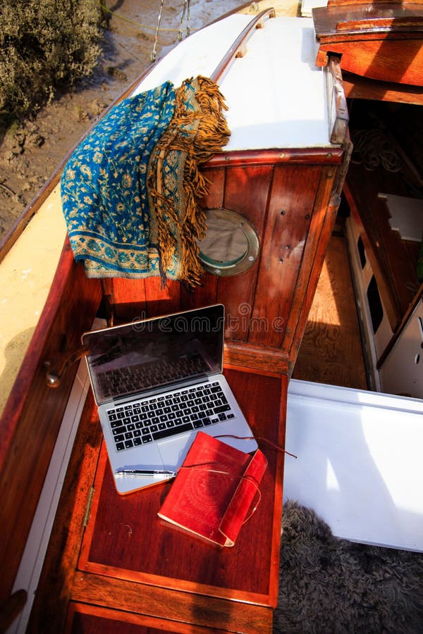 Vertical Closeup Shot of a Leather Notebook and Opened Laptop Computer ...