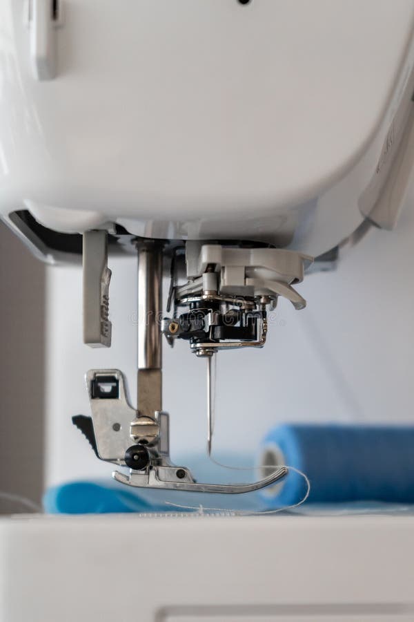 Vertical Closeup Shot of the Needle on a White Sewing Machine Stock ...