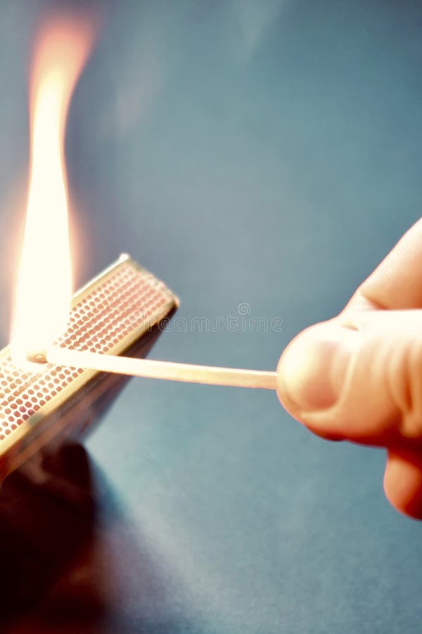 Lighting a Match Against a Black Background Stock Photo - Image of fire ...