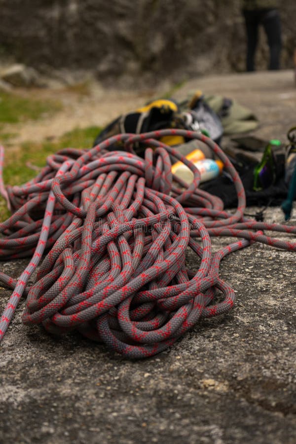 Vertical Closeup Shot of a Pile of Hiker Rope on a Rock Stock Photo ...