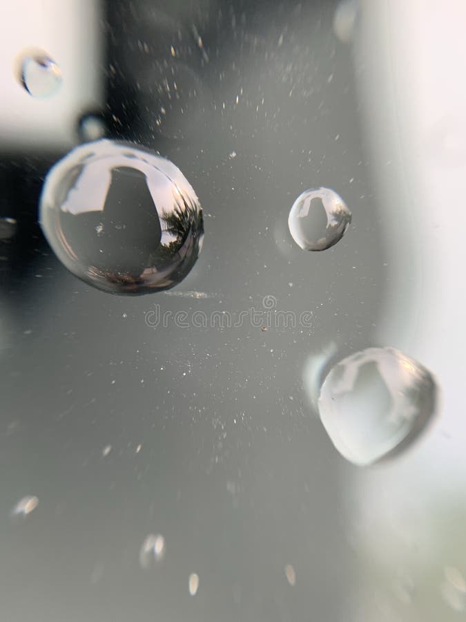 Vertical Closeup Shot of Reflective Water Drops Stock Photo - Image of ...