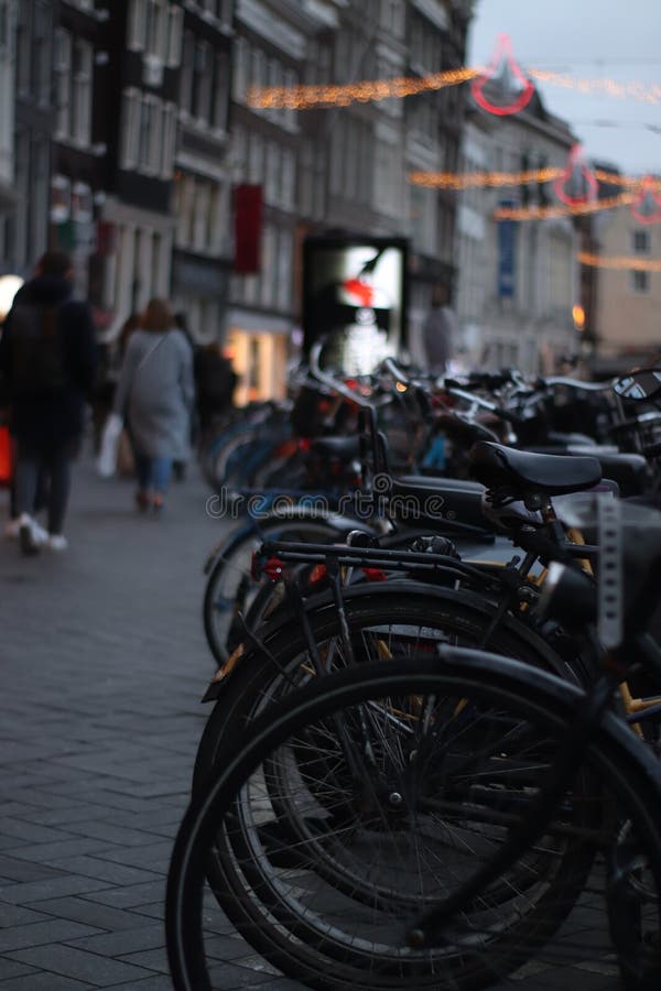 Vertical Closeup Shot of a Row of Bikes Parked Along the Street Stock ...